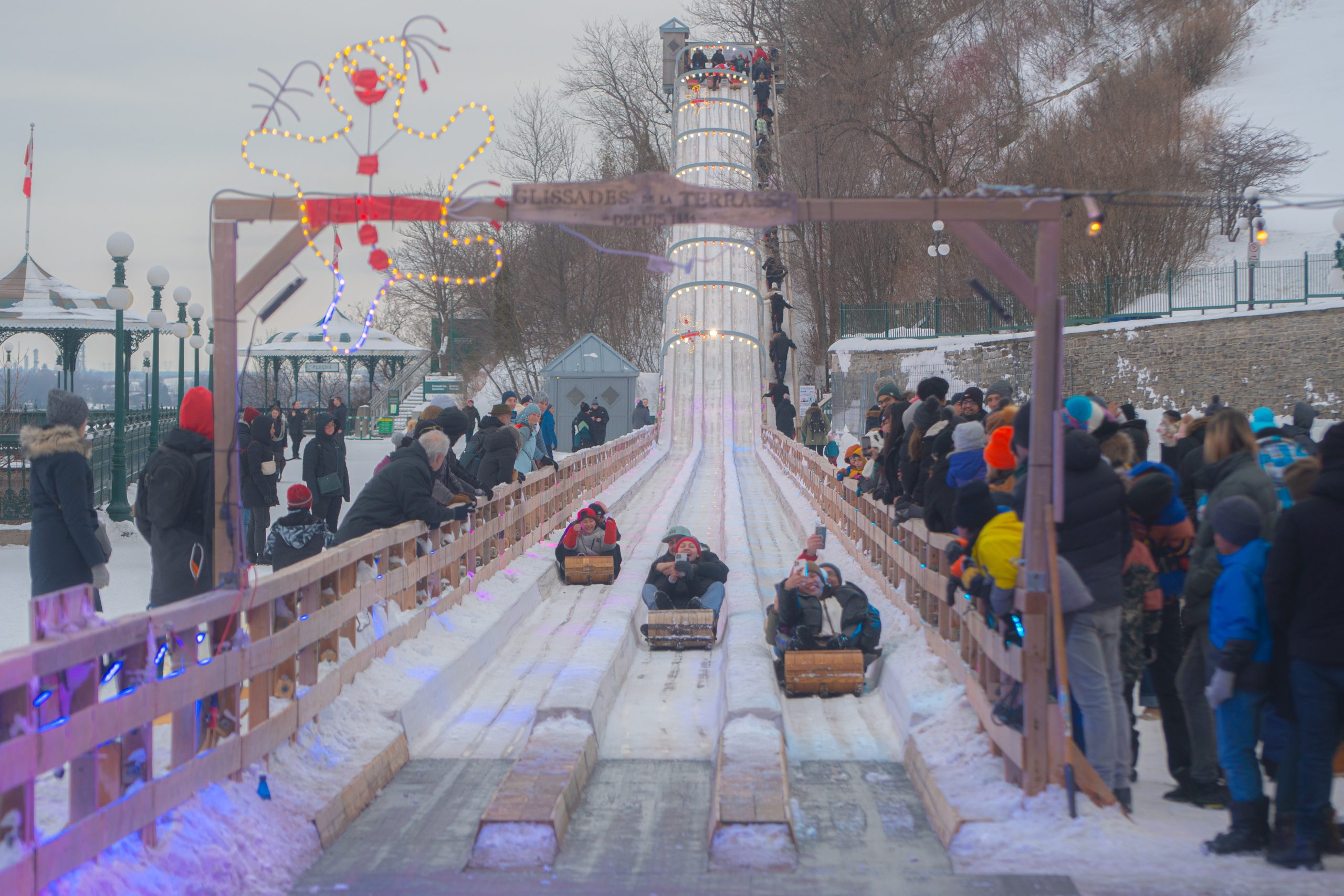 Carnival goers swing and slide on Dufferin Terrace - The Quebec ...